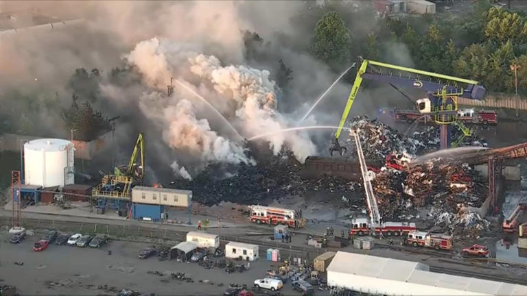 Crews monitoring hotspots after containing fire at Camden recycling ...