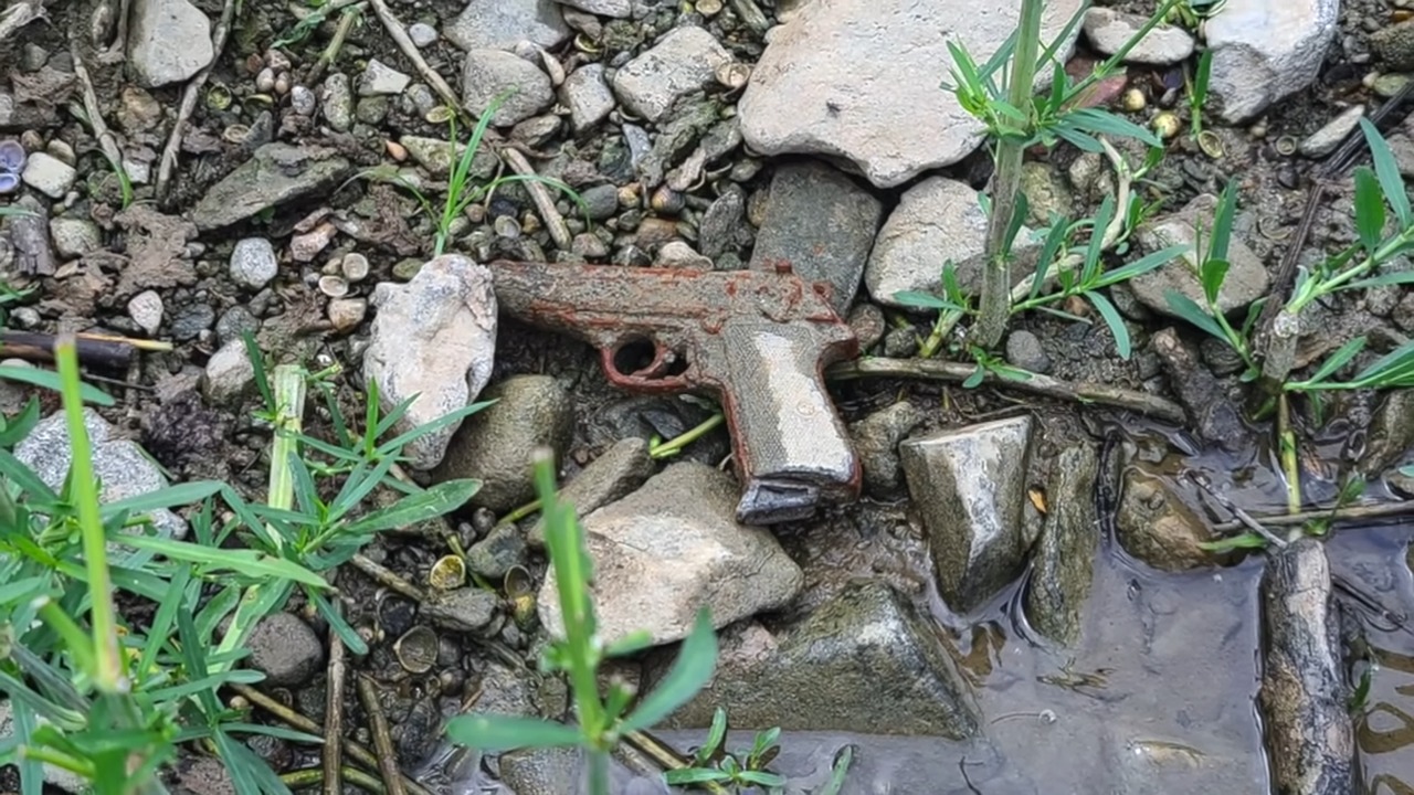 He found a handgun before reaching the water, but the river was hiding ...