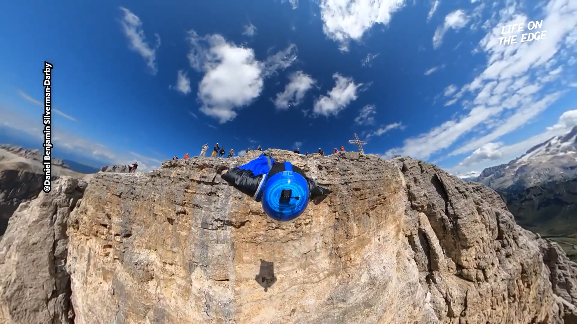 POV base jump from cliff captures wingsuit flight over Italian mountains
