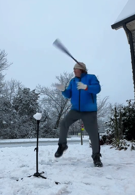 Hitting a snowball with a bat