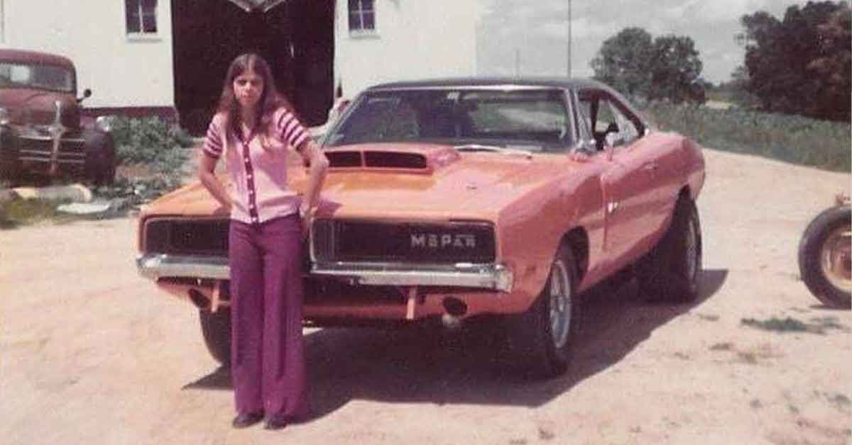 20 proud retro muscle car owners posing with their 1970s rides