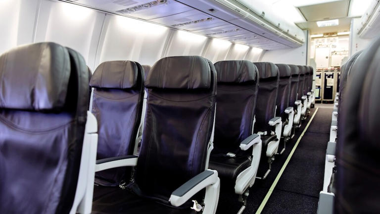 Here’s how to lift the armrest in the aisle seat