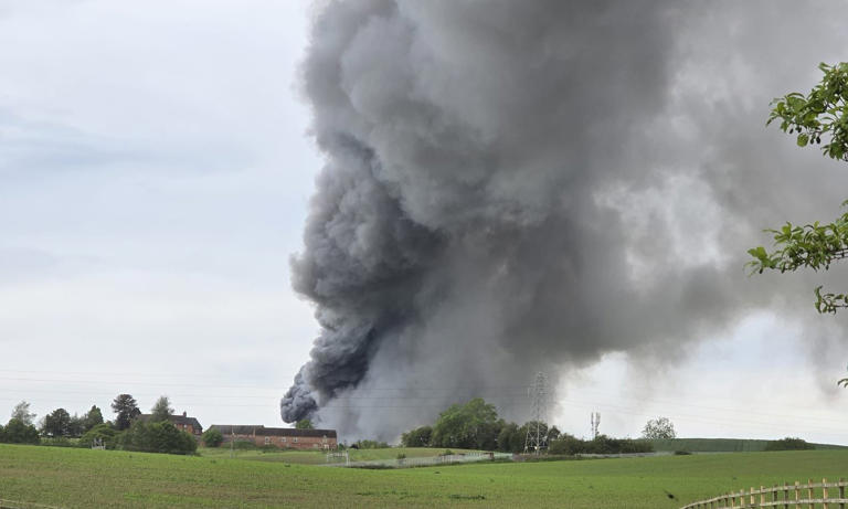 Fire crews battle massive chicken farm blaze as plumes of smoke are ...