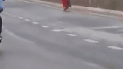 Red outfit, white cloth on head: Video shows woman running with burning ...
