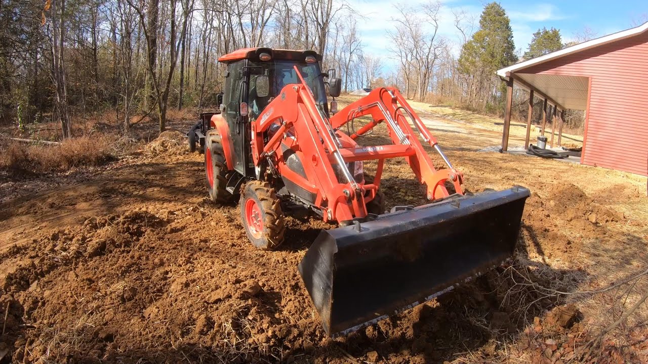 Installing drainage and piping for a DIY pond and lawn project