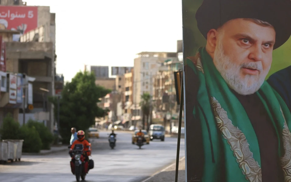Iraqi PM urges militias to join state after Sadr move