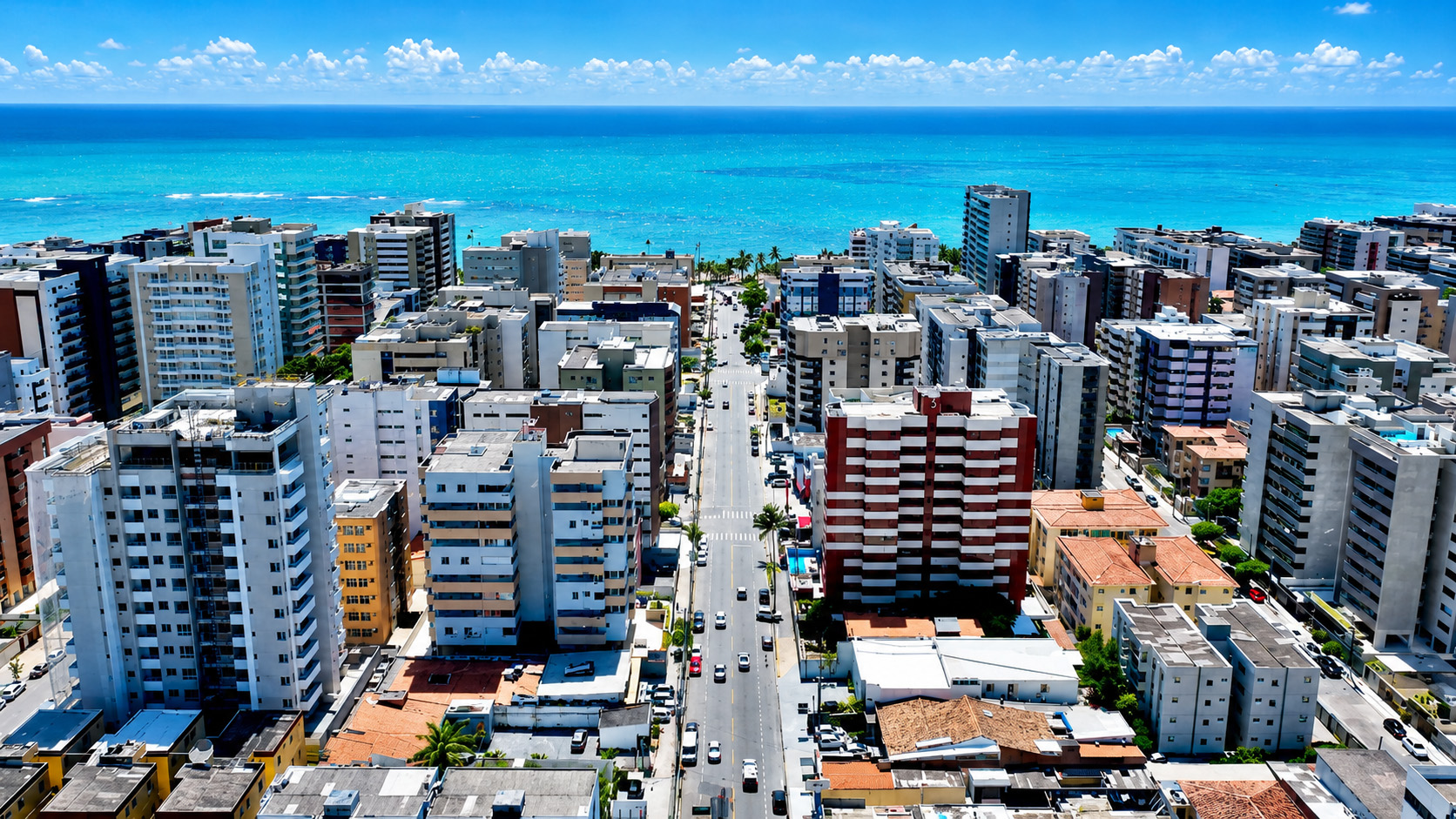 A coastal city skyline facing the endless open ocean