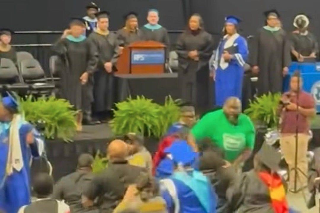 Brawl erupts at high school graduation after man attacks student on stage