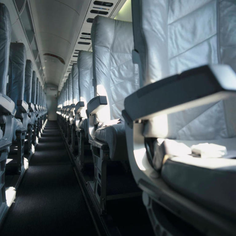 Here’s how to lift the armrest in the aisle seat