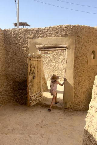 Family moves into a mud home that dissolves when it rains. Here's how ...