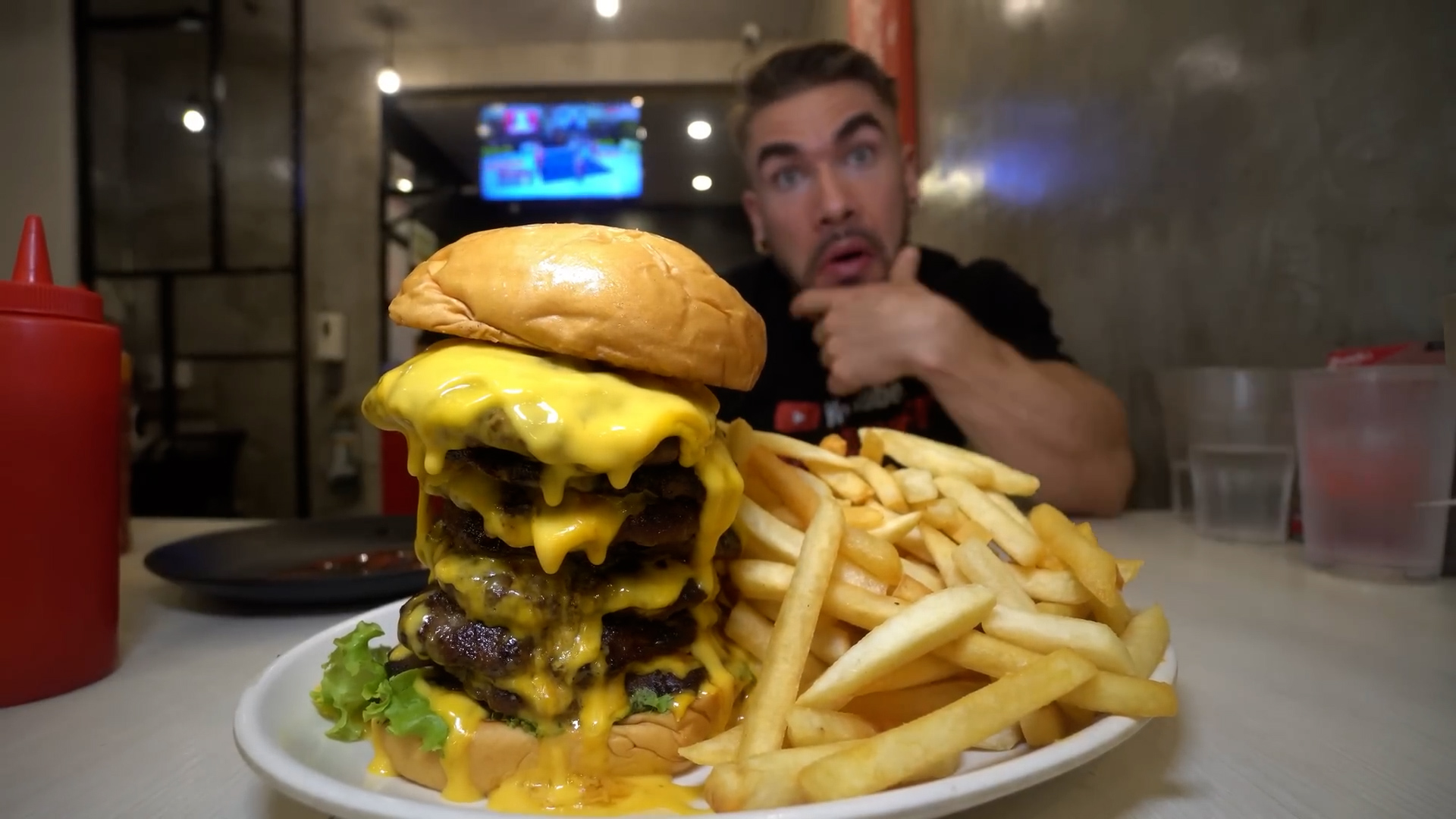 Man attempts giant 8-patty burger challenge in less than 10 minutes