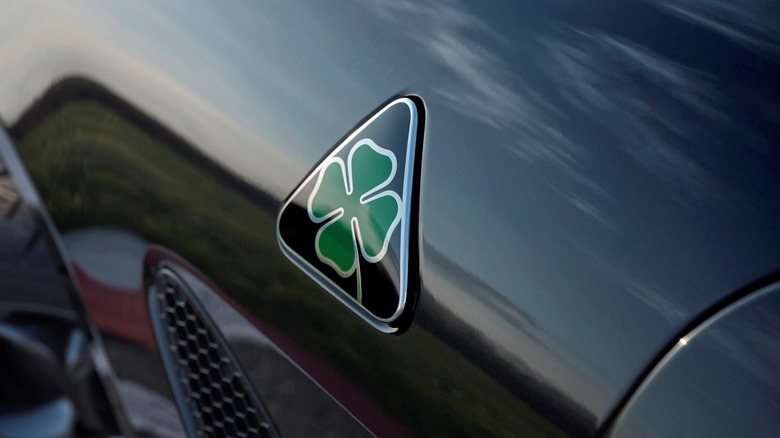 What does the four-leaf clover badge mean on Alfa Romeo vehicles?