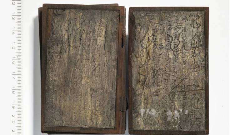 Archaeologists discovered an 800-year-old notebook inside a sealed ...