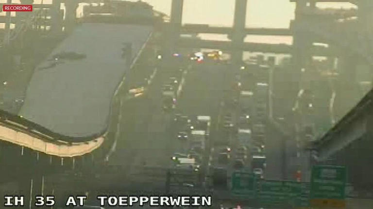 Commercial vehicle slams TXDOT barricade trucks, closes I-35 at Loop 1604
