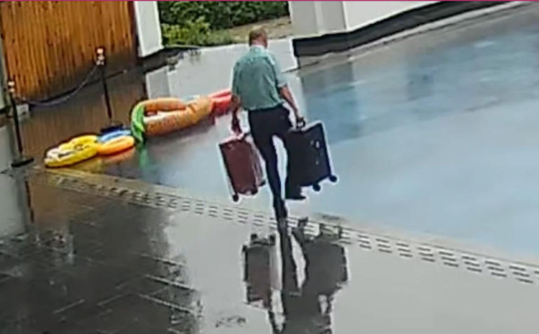 Hotel porter walks straight into swimming pool after failing to notice ...
