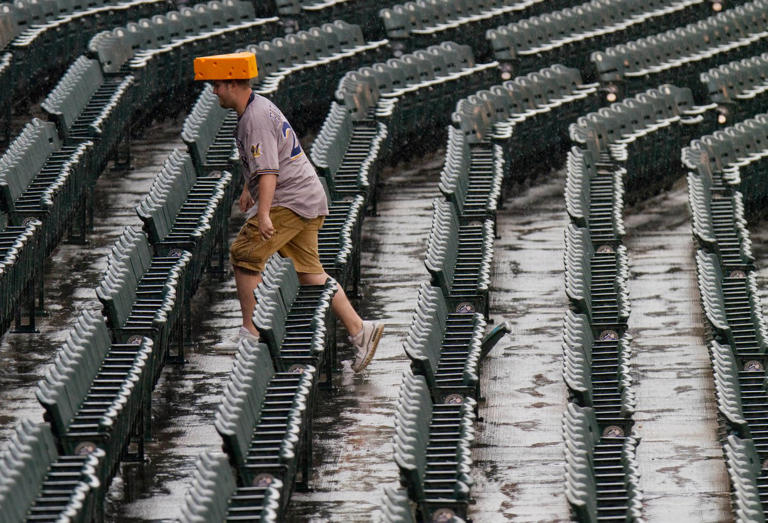 The cheesehead hat is a sunny nod to America's 'hold my beer' exuberance