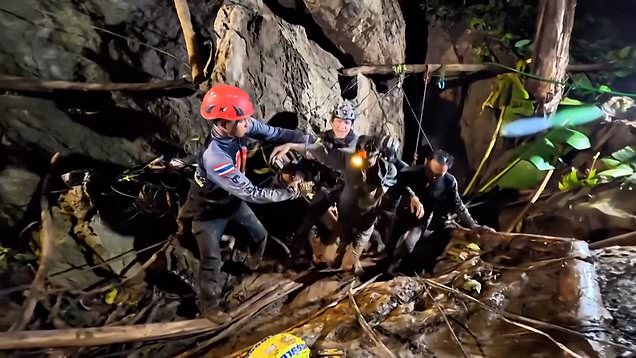 Rescuers pull out first trapped person from flooded Laos cave