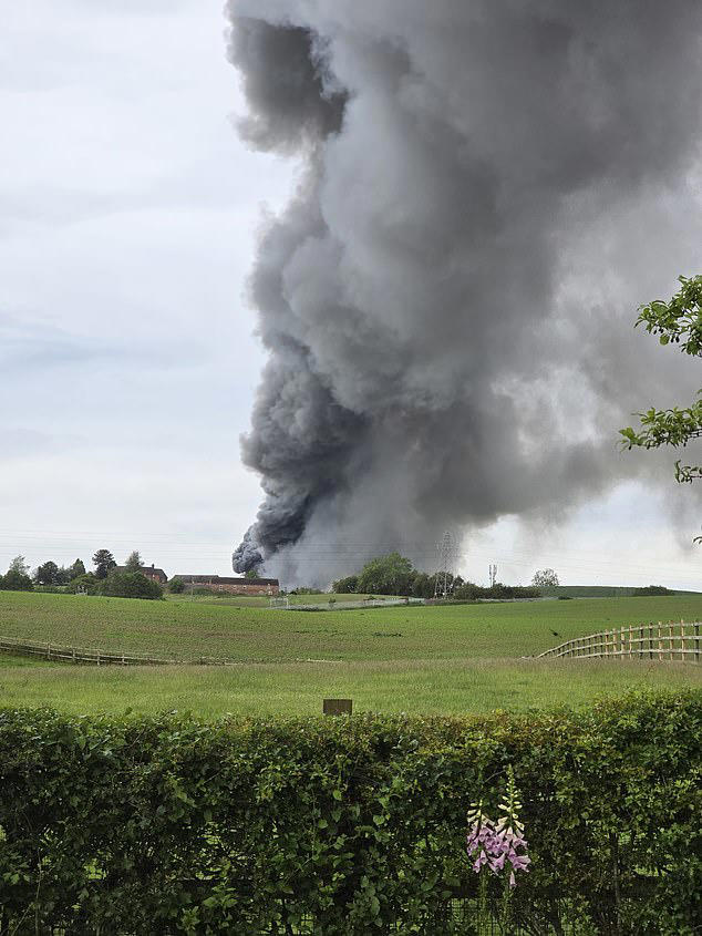 Fire crews battle massive chicken farm blaze as plumes of smoke are ...