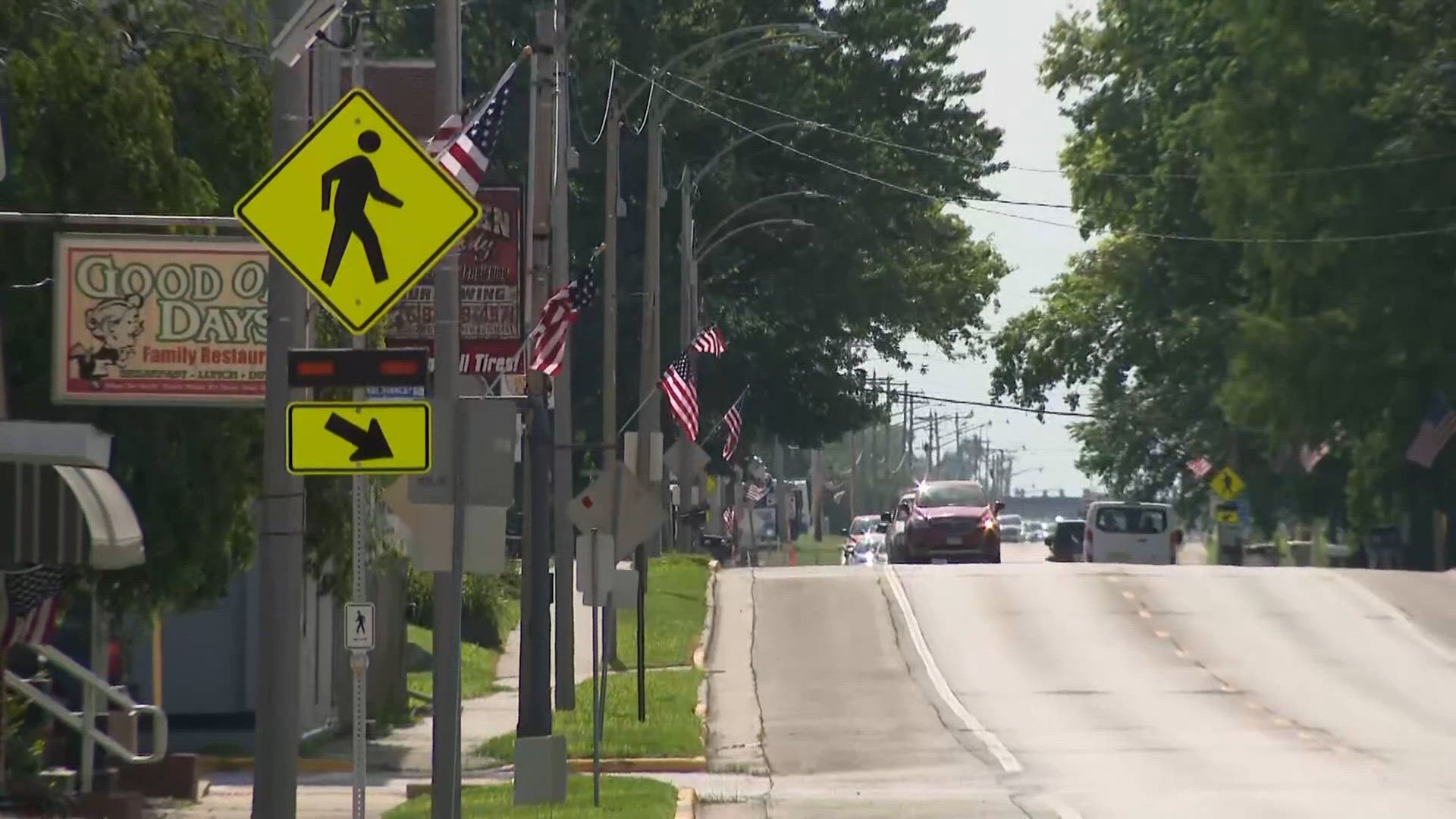 New Baden puts up flags to honor fallen officer
