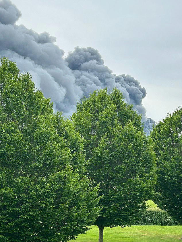 Fire crews battle massive chicken farm blaze as plumes of smoke are ...