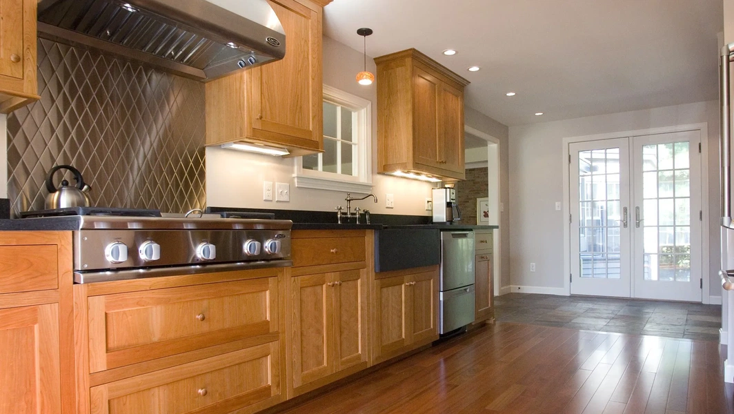 Designers move away from cool-toned kitchen floors in 2026