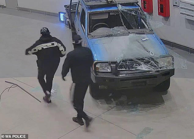 Wild moment thieves steal an ATM after ramming a ute through the doors ...
