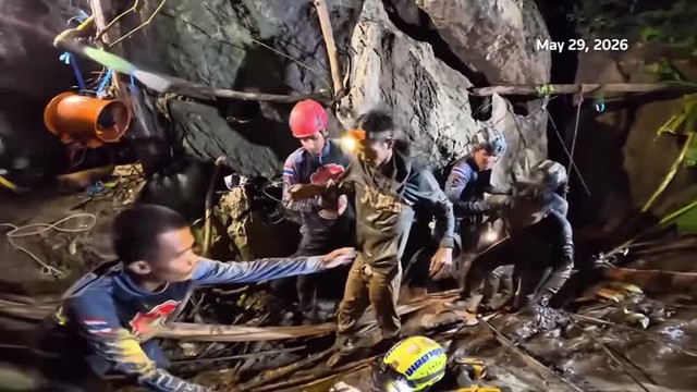 Rescuers pull out first trapped person from flooded Laos cave