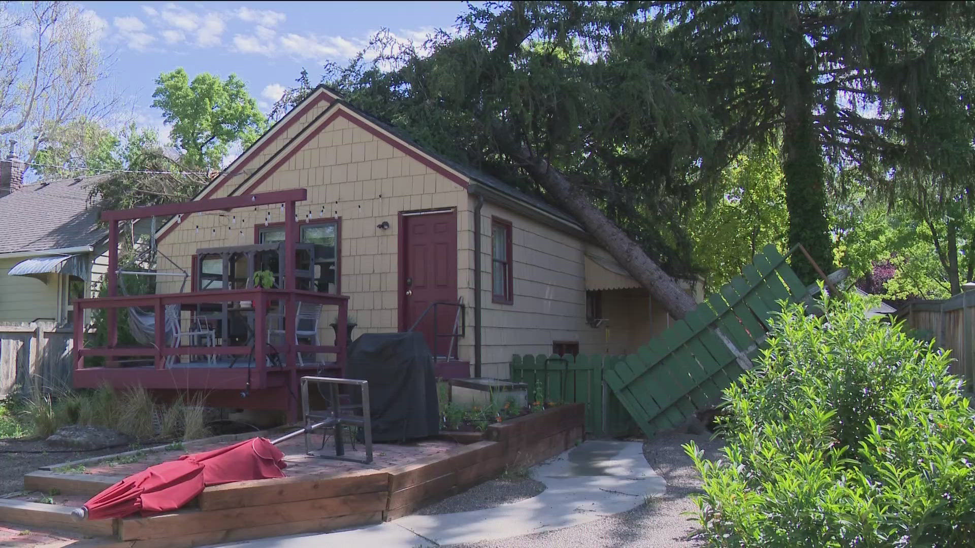 Strong winds topple tree onto Boise home