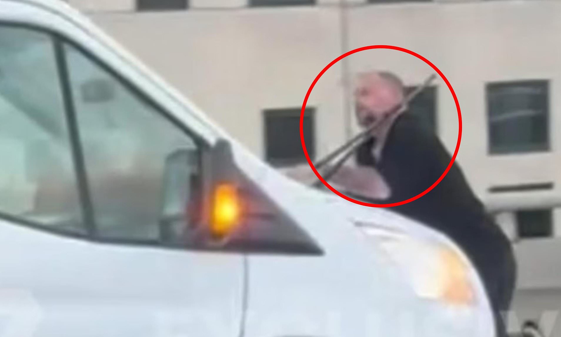 Dramatic moment angry driver jumps on the bonnet of a moving van ...