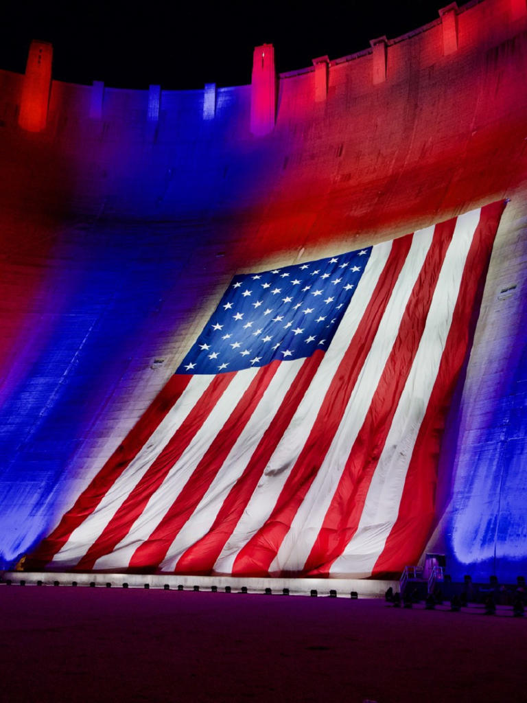 Gargantuan American flag unfurled at iconic Western landmark to ...