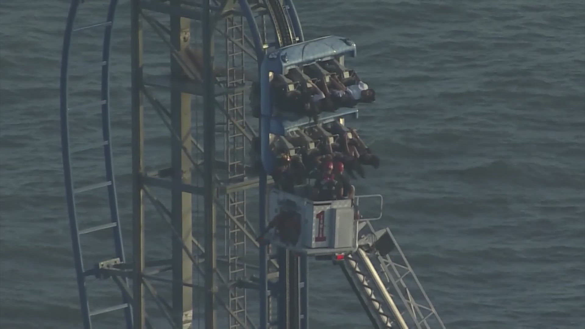 Iron Shark roller coaster car lowered to ground after Galveston rescue