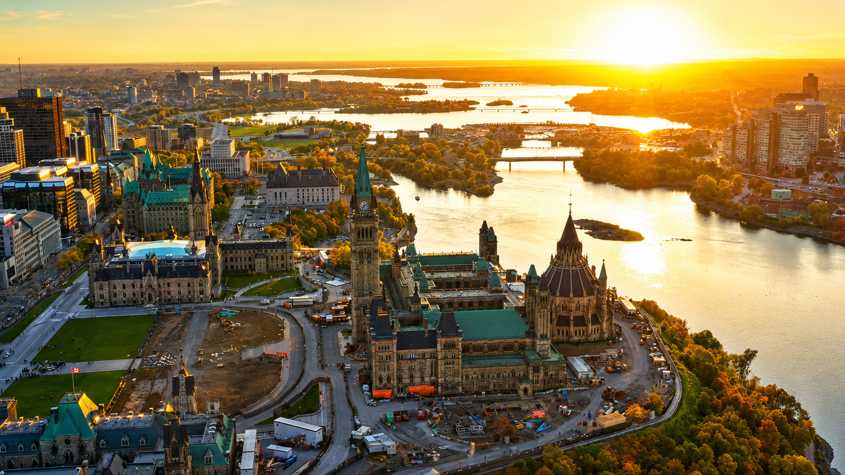 Ottawa’s historic skyline glowing above the river at sunset