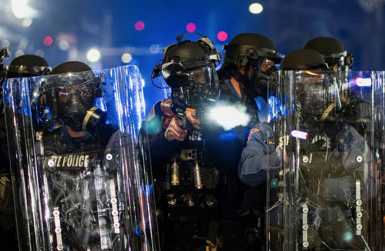New Jersey state police assert control outside migrant detention center