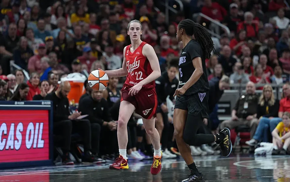 Clark sets WNBA assist record in Fever's narrow loss