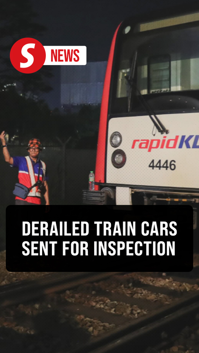 Four derailed train cars in depot for inspection