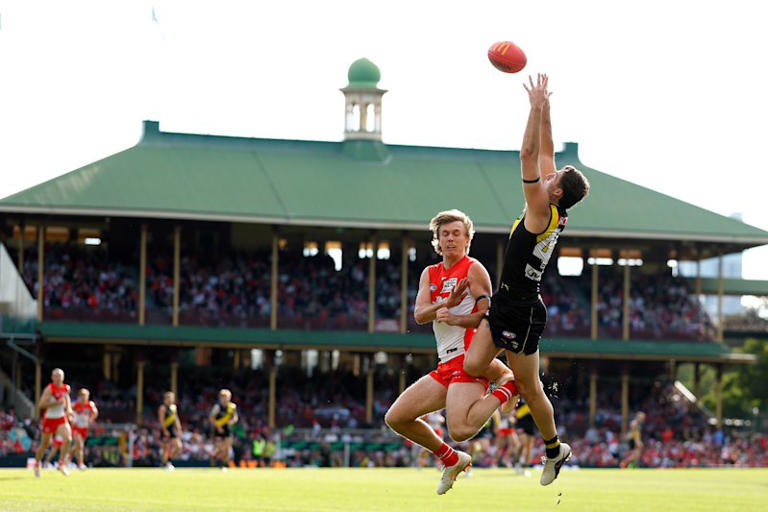 Curnow’s eight-goal haul leads way as Swans run riot against Tigers