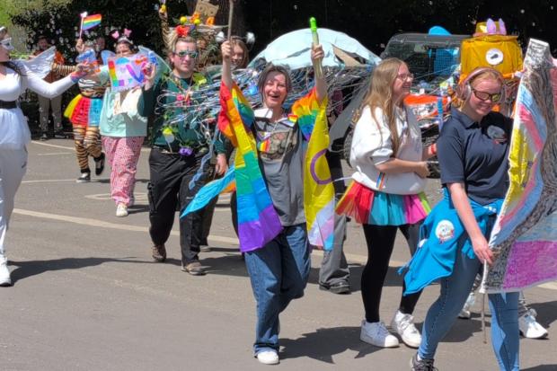 College students and staff celebrate Pride Month with vibrant parade