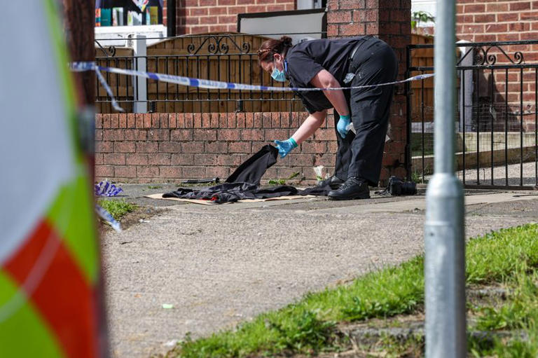 Knife attack investigation on Wigan street as forensics comb scene