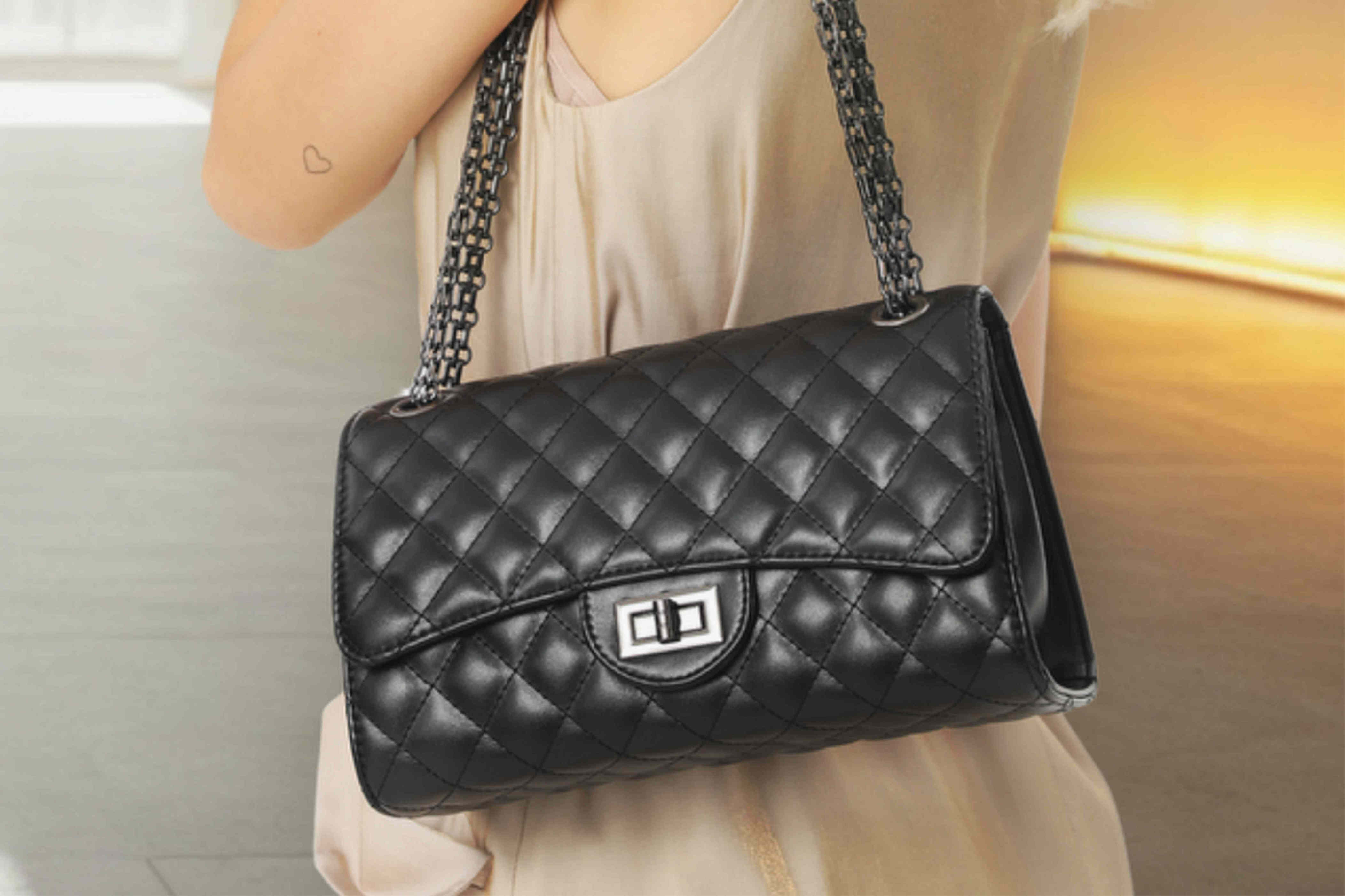 This quilted bag looks like it belongs behind glass in a Chanel ...