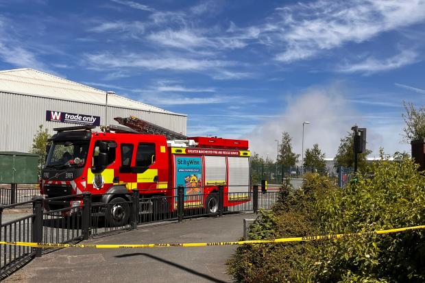 Crews continue to battle large scrapyard fire which broke out 5 hours ago