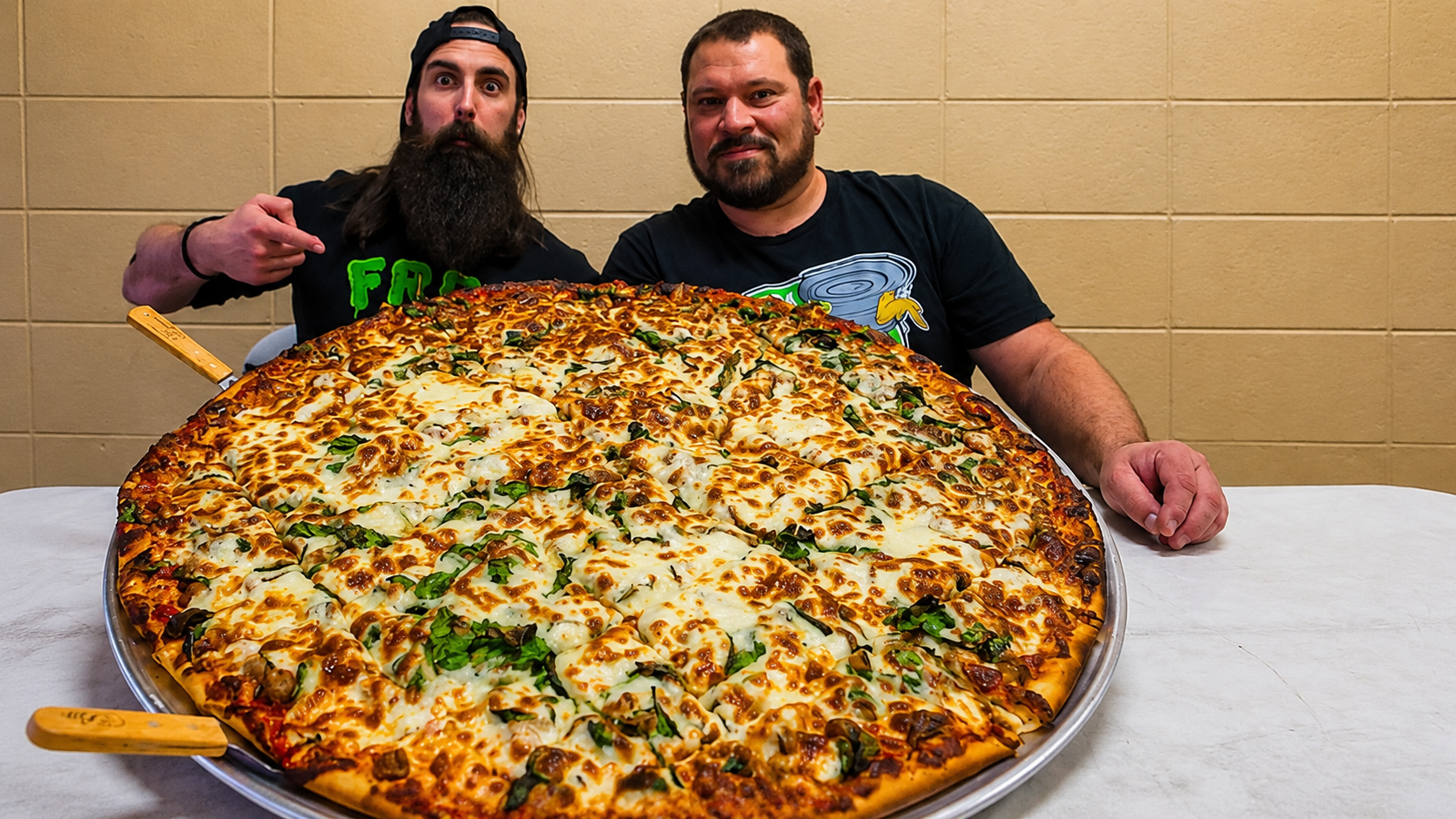 Two guys took on a pizza built like a monster
