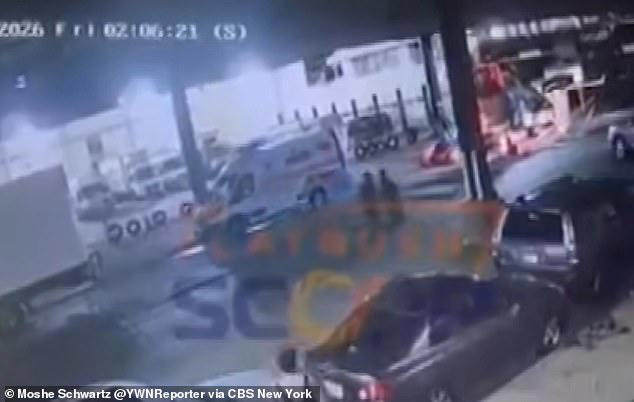 Mystery as large group of men emerge from manhole into middle of busy ...