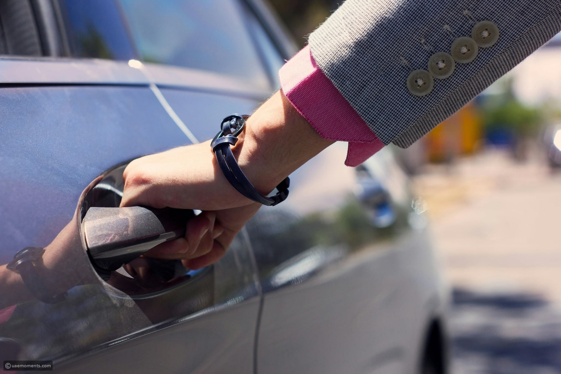 The real purpose of the handles above your car doors explained