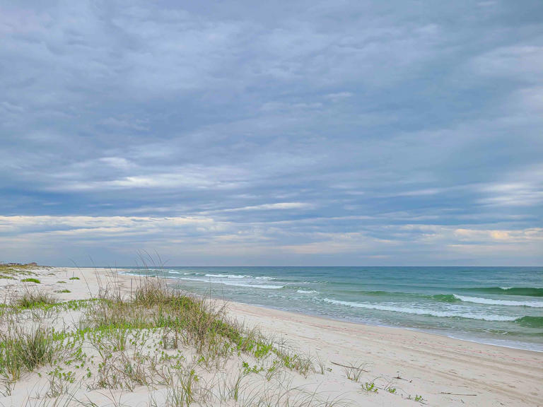 This quiet Alabama beach community has a ferry, a fortress, and hardly ...