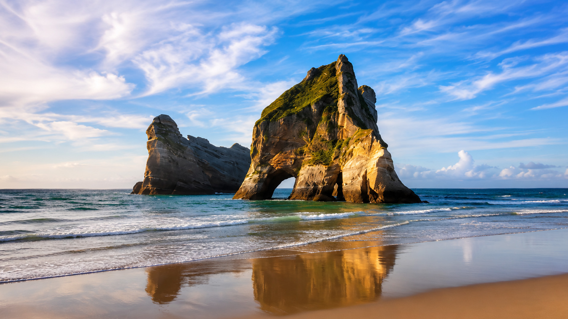A natural arch standing against the ocean