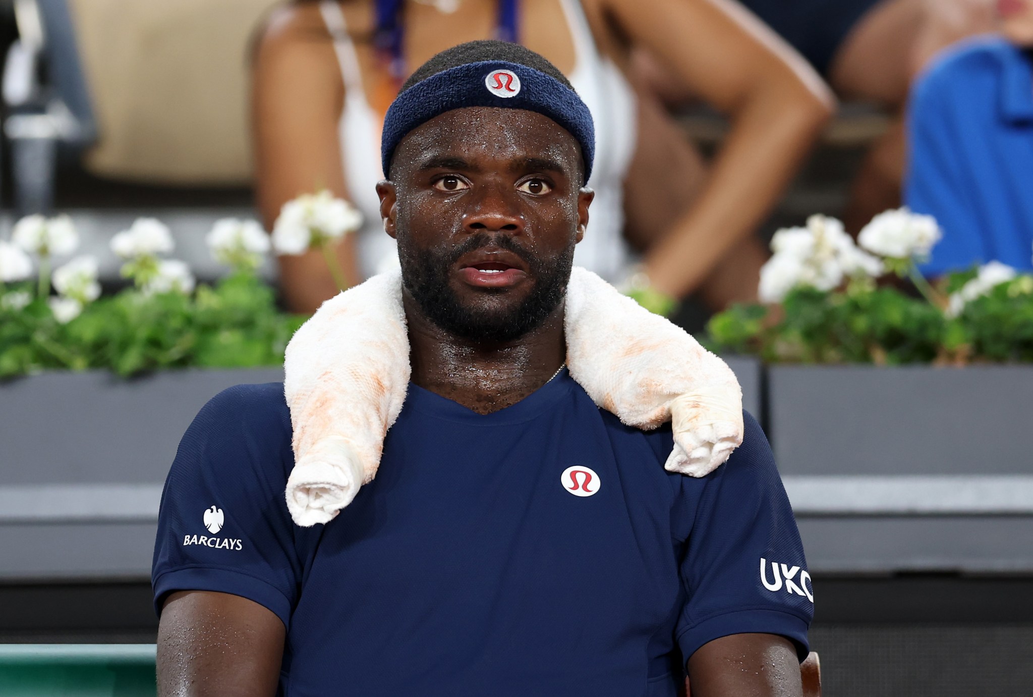 Frances Tiafoe, Jaime Faria separated by umpire during Roland-Garros match