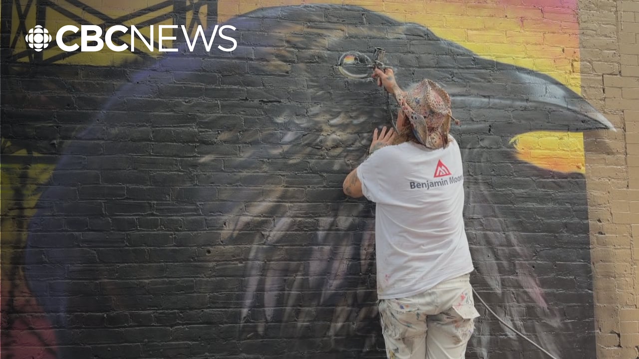 Mural artist Archer spraying character into back alleys and on barn ...