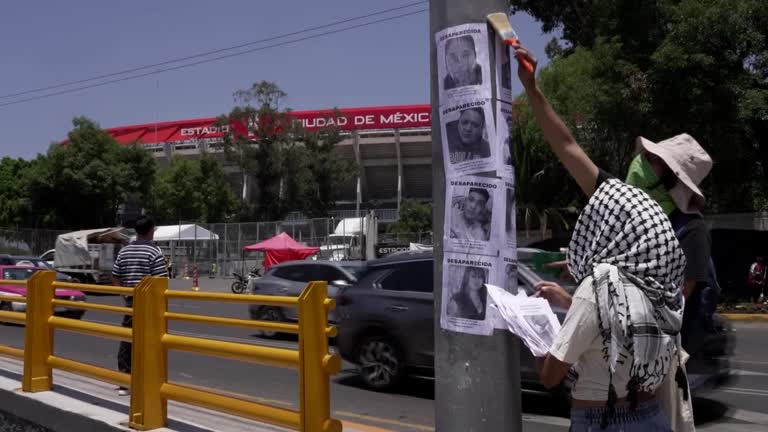 Families of missing persons cover surroundings of Mexico City stadium ...