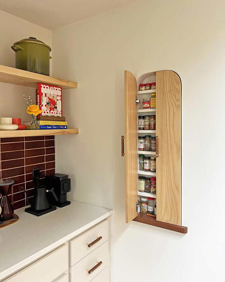A DIY spice cabinet is the focal point of this kitchen - it's so whimsical