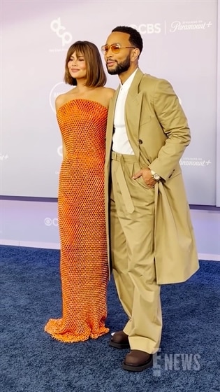 John Legend and Chrissy Teigen pose at the AMAs